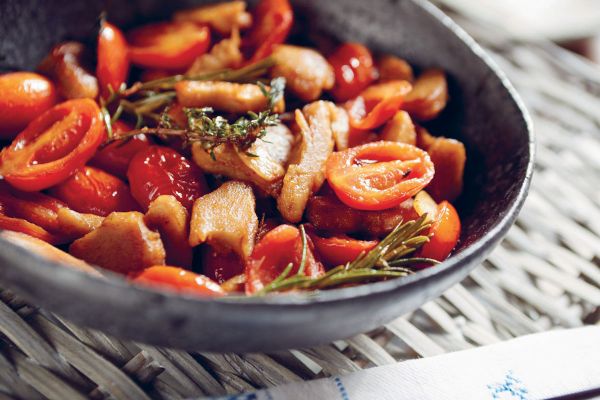 Vegan chicken straccetti with tomatoes and rosemary in a bowl. Plant ...
